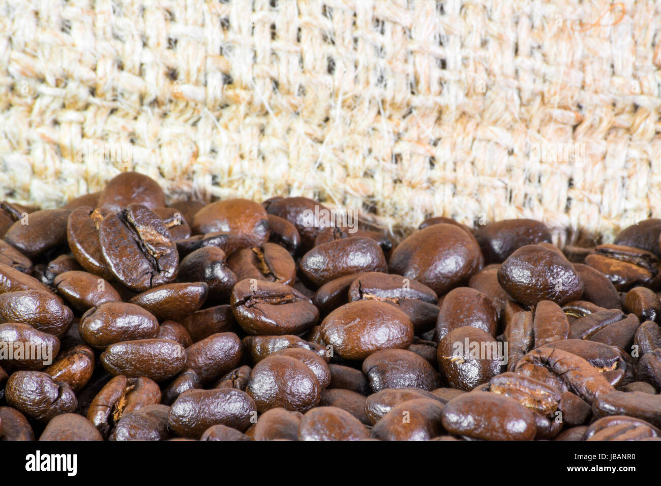 Detail of coffee beans and jute bag background Stock Photo - Alamy