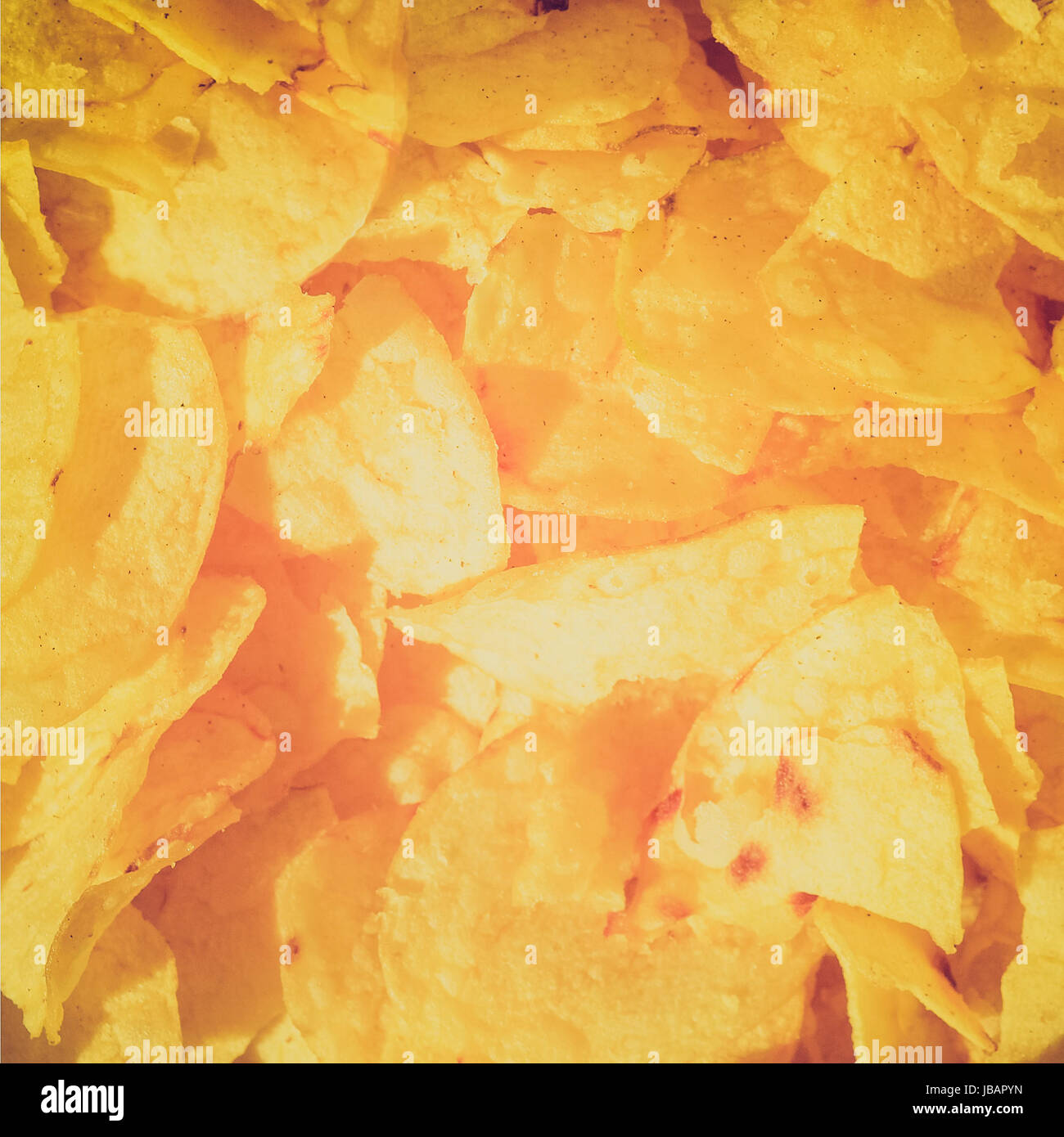 Vintage retro looking Detail of crisps potato chips snack food Stock ...