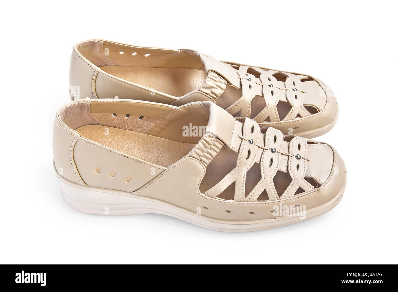 A pair of women's beige shoes isolated on white background Stock Photo ...
