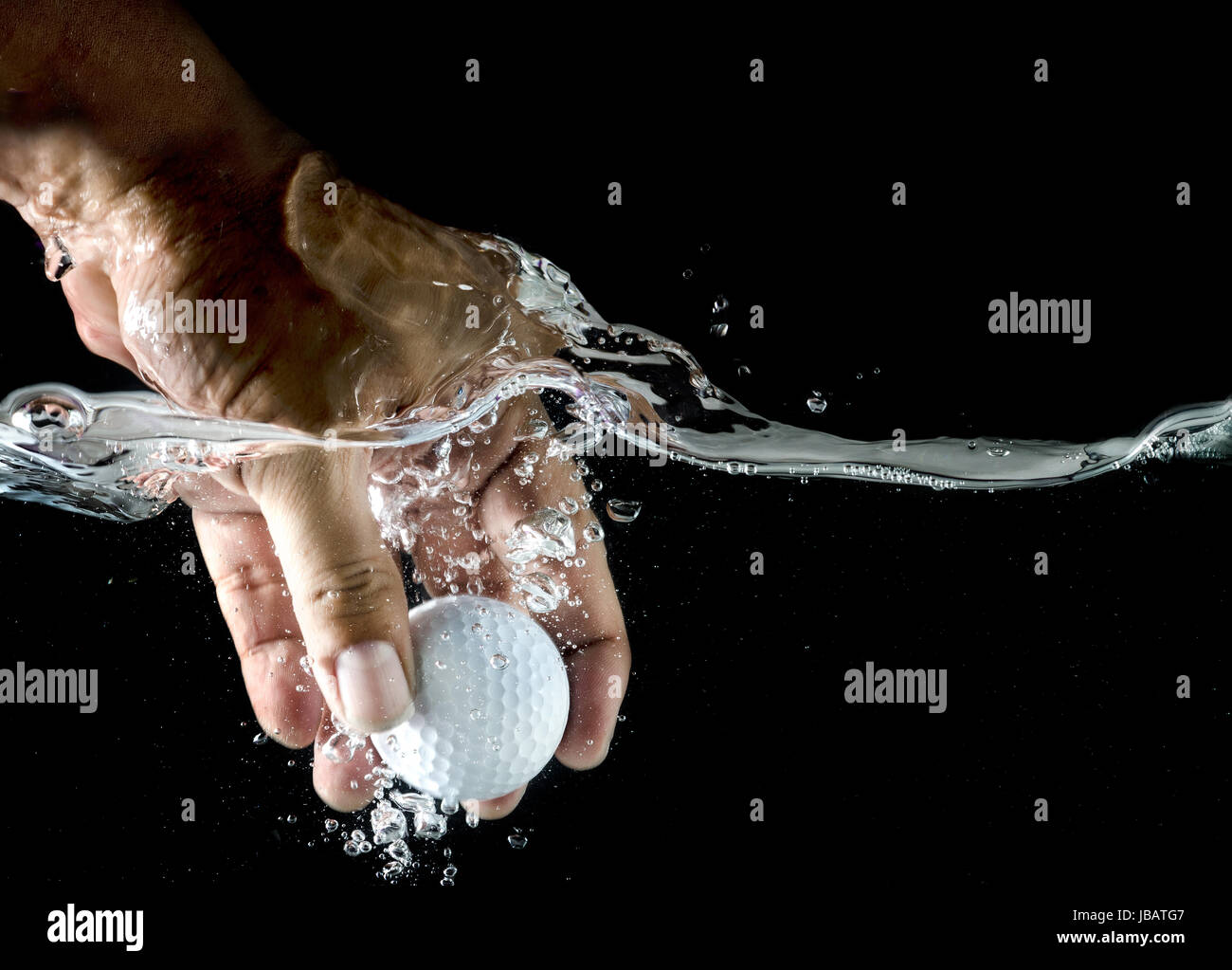 Golf ball splashing water hi-res stock photography and images - Alamy