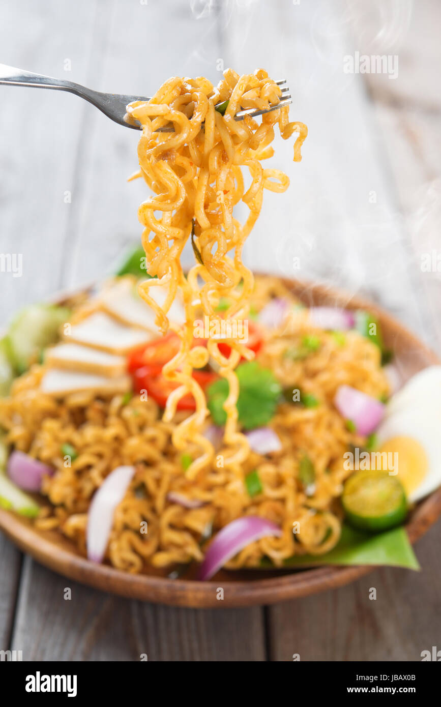 Spicy fried curry instant noodles or Malaysian style maggi goreng mamak ...