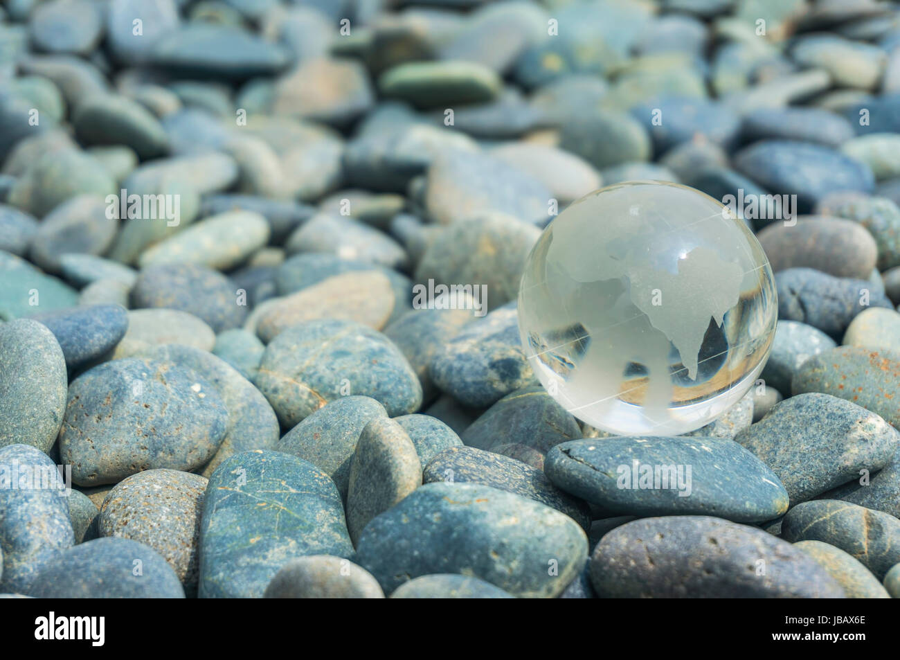 Earth transparent glass with stone Stock Photo - Alamy