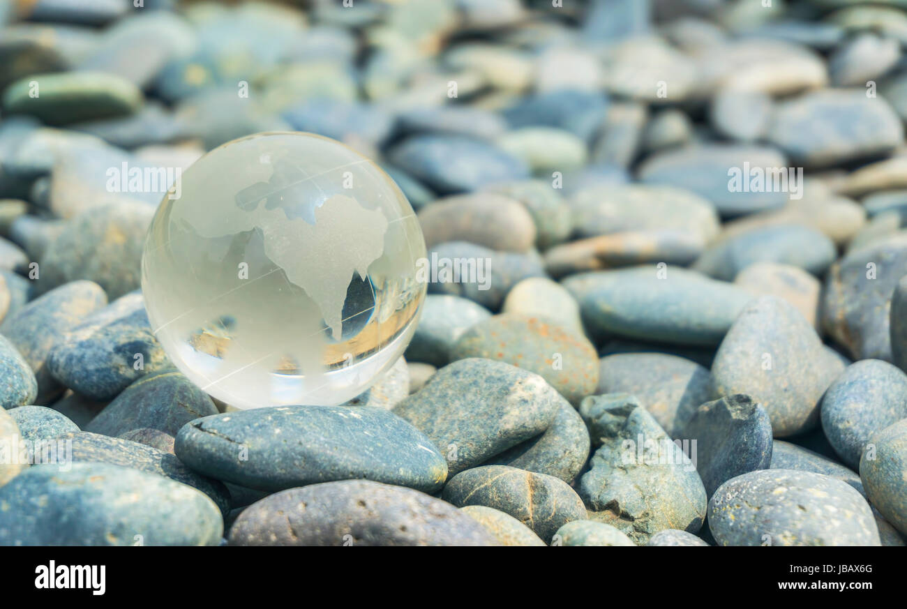 Earth transparent glass with stone Stock Photo - Alamy