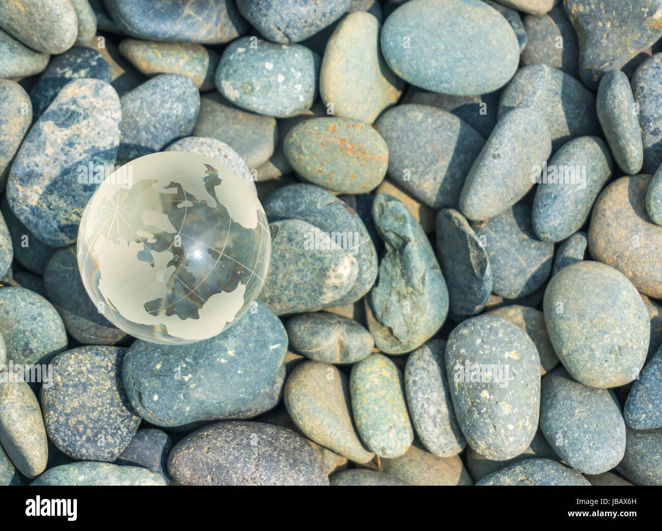 Earth transparent glass with stone Stock Photo - Alamy