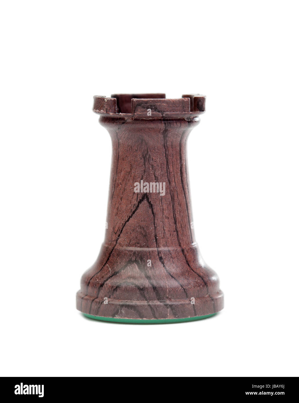 The black rook. Wooden chess pieces isolated on a white background ...