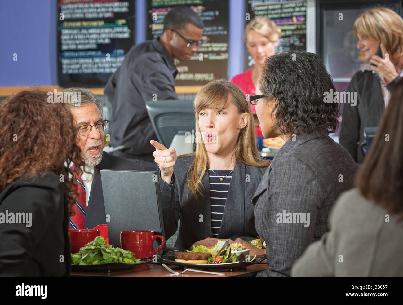 Group of business people arguing in cafeteria Stock Photo - Alamy
