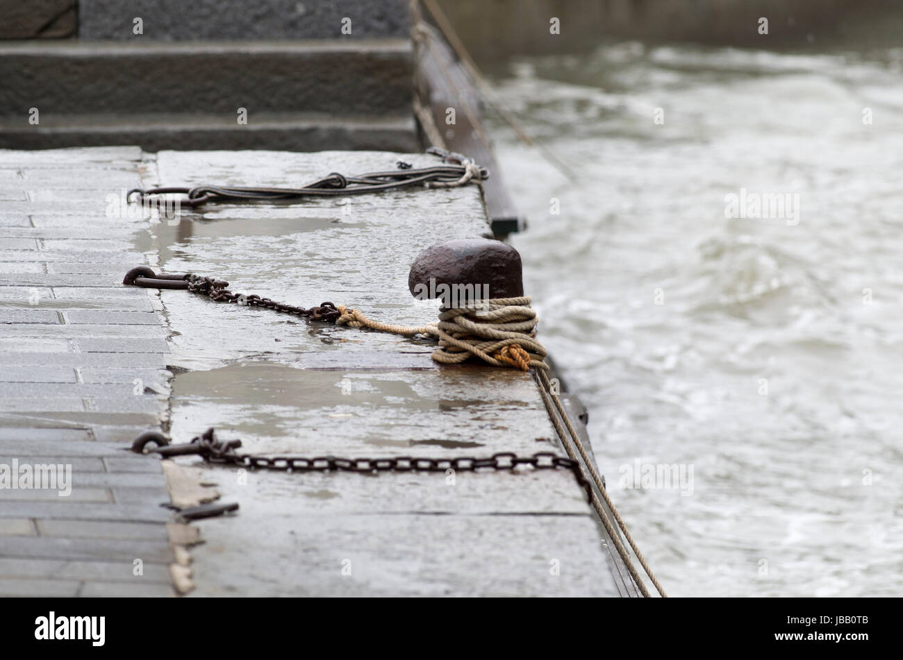 Sea flooding jetty during storm Stock Photo - Alamy
