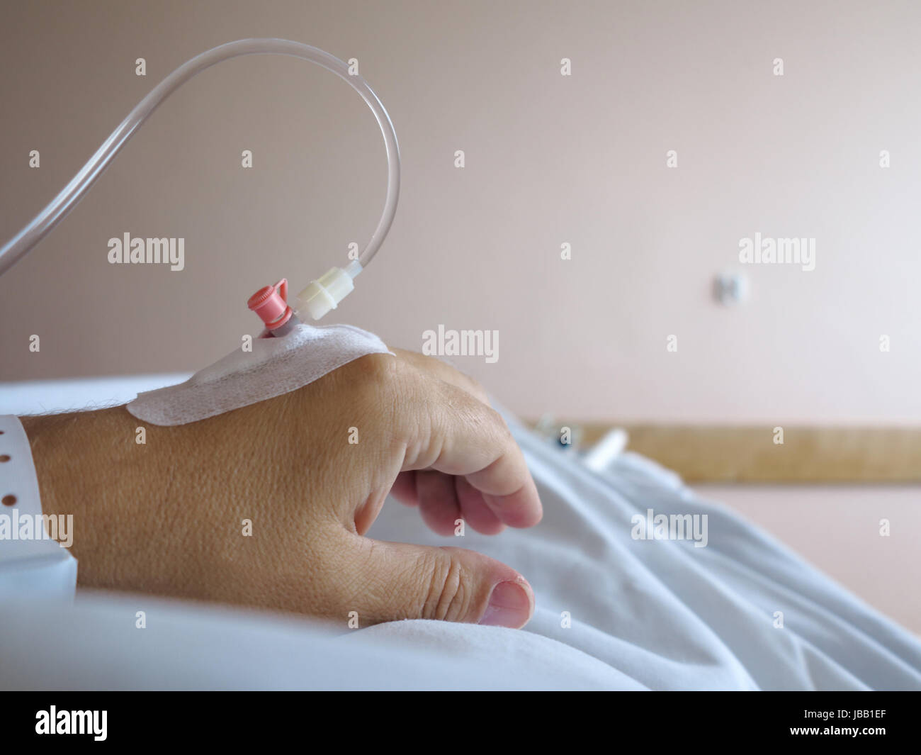 Arm of a male patient in the hospital with an iv intravenous drip Stock ...