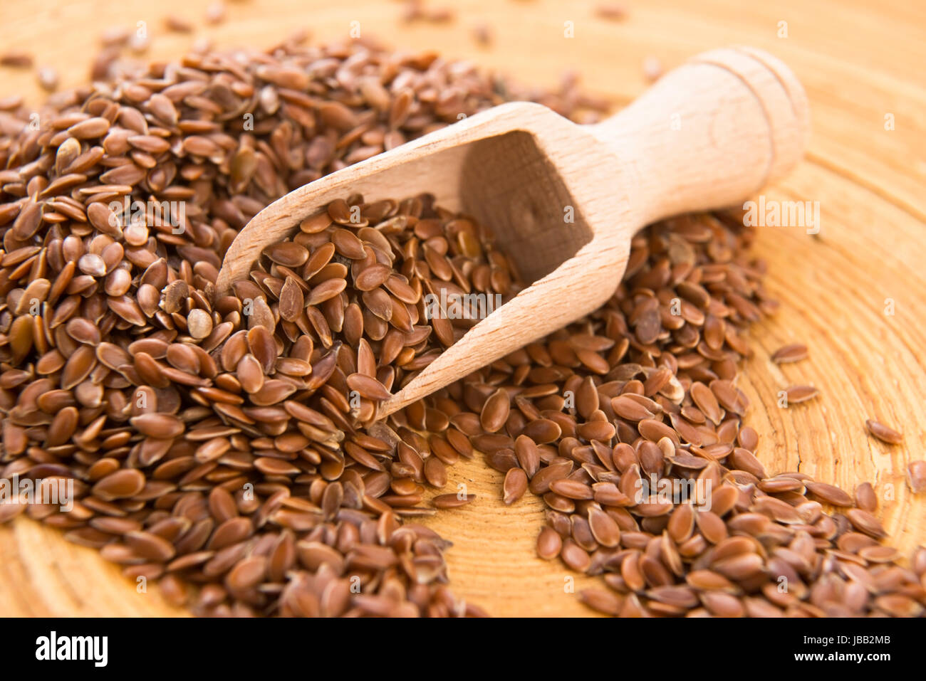 Wooden spoon with flax seed Stock Photo - Alamy