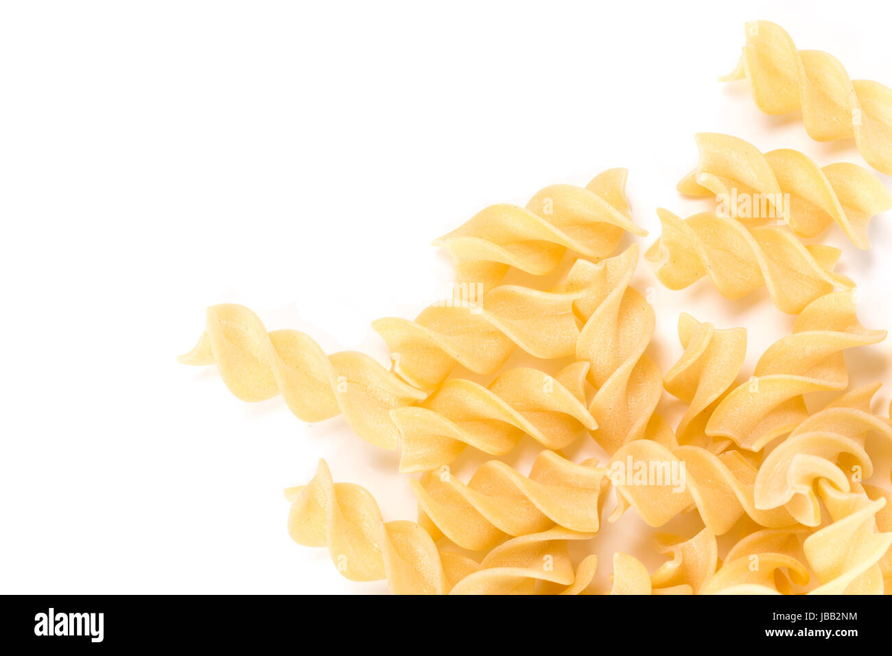 fusilli dry pasta isolated on white background Stock Photo - Alamy