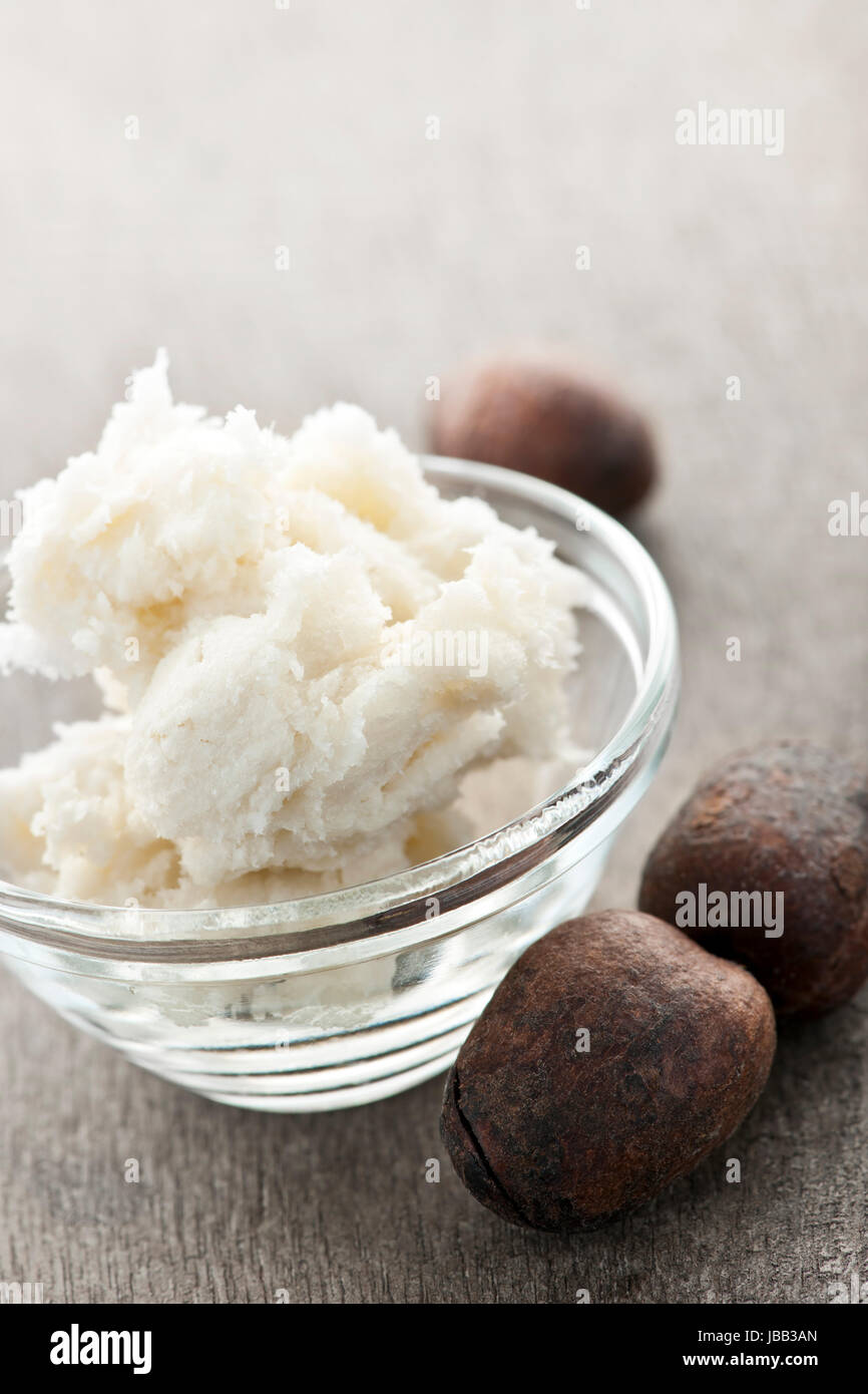Shea nuts and sheabutter in glass bowl Stock Photo - Alamy
