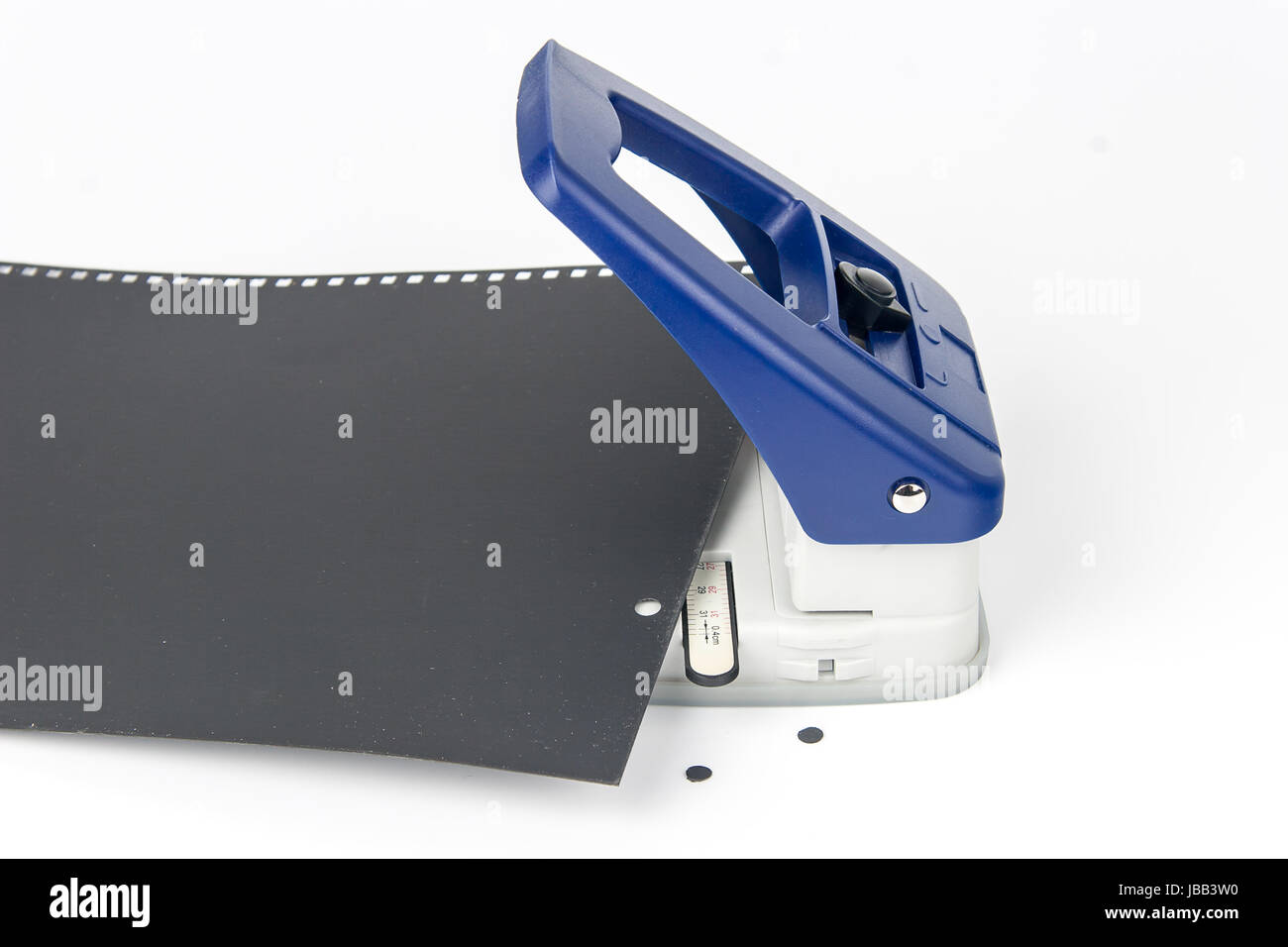 Office Puncher Unit isolated on white background Stock Photo - Alamy