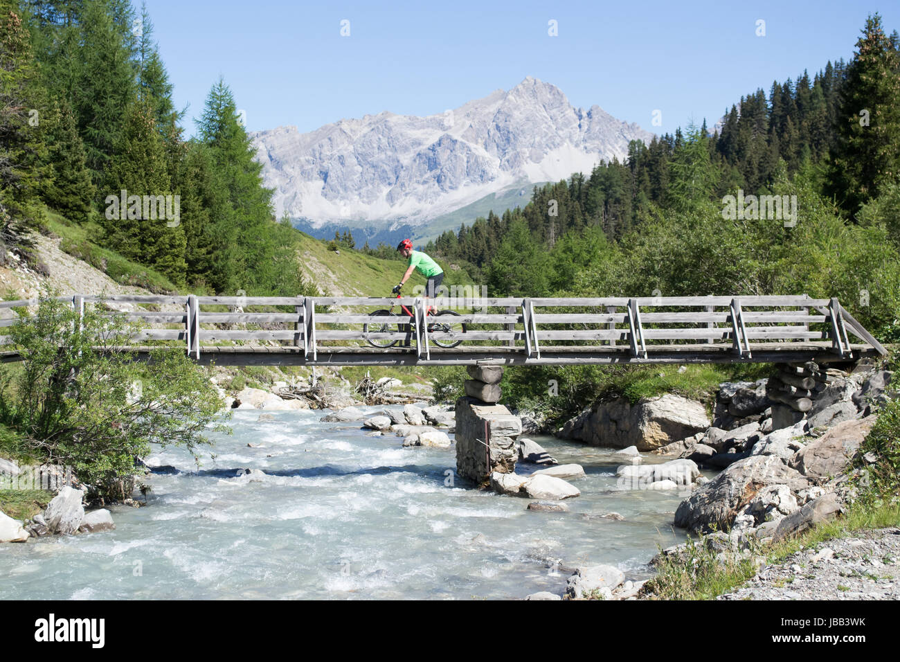 Mountain Biker Crossing Wooden Bridge Stock Photos & Mountain Biker ...