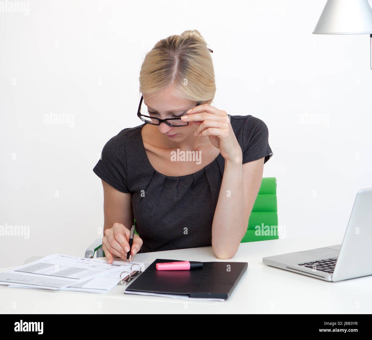 Young Business woman is smiling while working at work desk Stock Photo ...