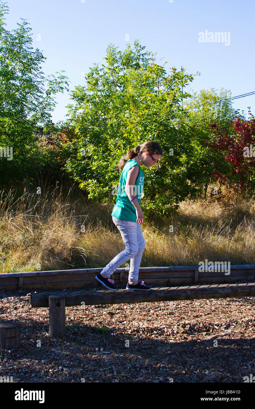 Young girl on balance beam Stock Photo - Alamy