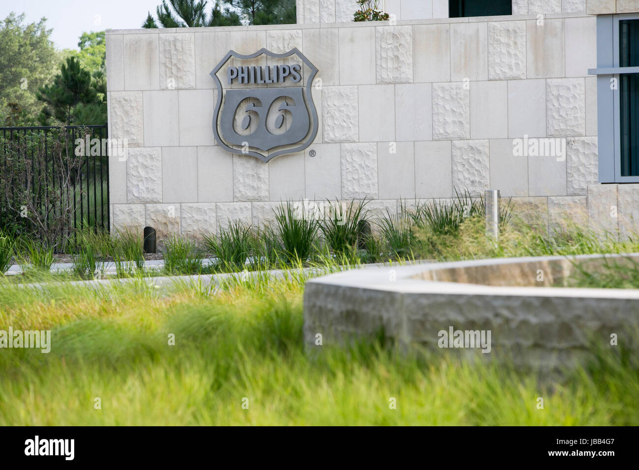 A logo sign outside of a the headquarters of The Phillips 66 Company in ...