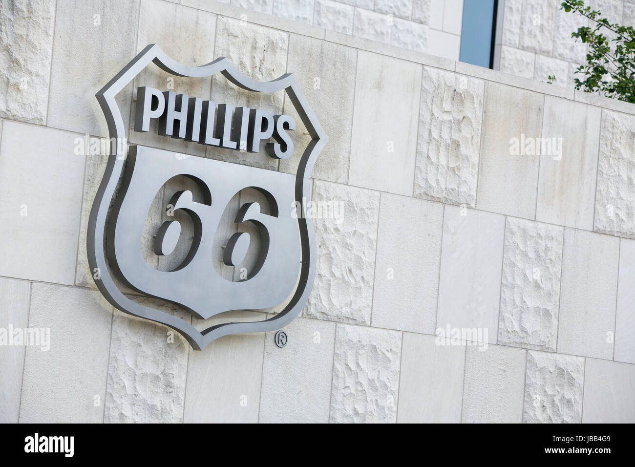 A logo sign outside of a the headquarters of The Phillips 66 Company in ...