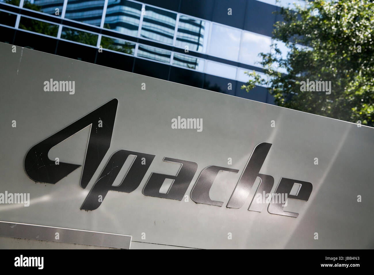 A logo sign outside of the headquarters of the Apache Corporation in ...