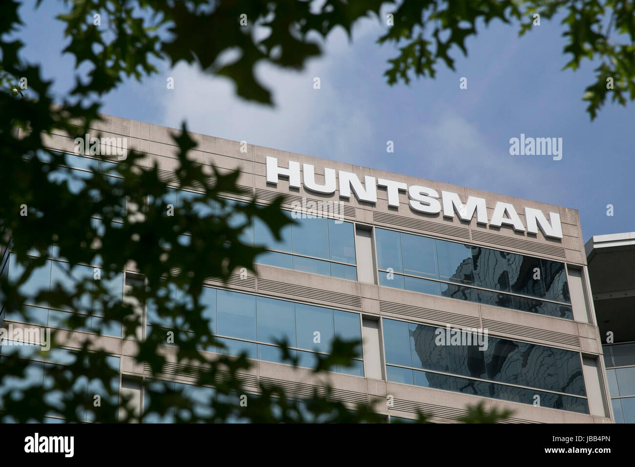 A logo sign outside of the headquarters of the Huntsman Corporation in ...
