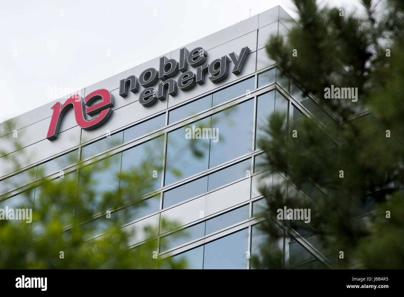 A logo sign outside of the headquarters of Noble Energy, Inc., in ...