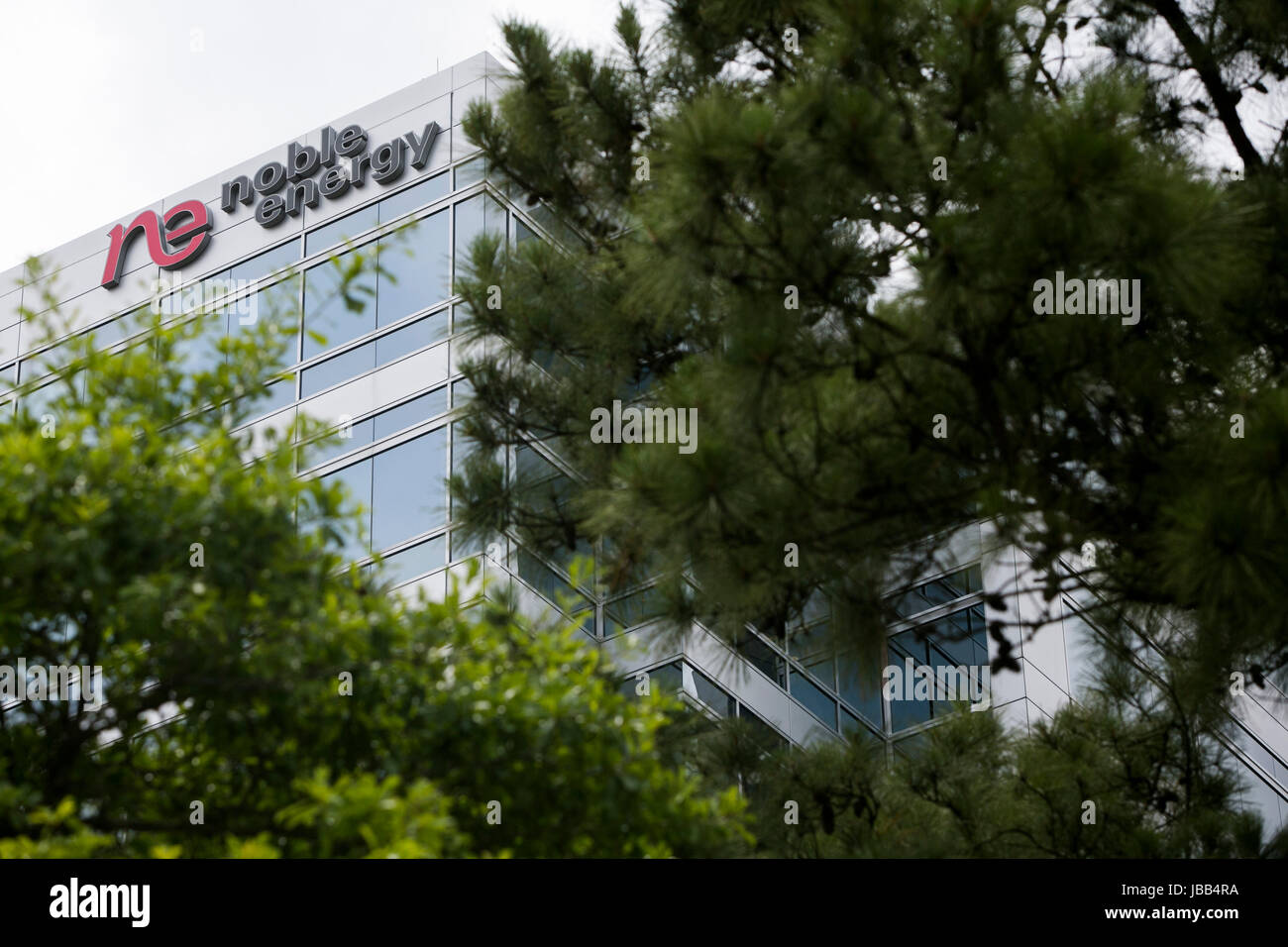 A logo sign outside of the headquarters of Noble Energy, Inc., in ...