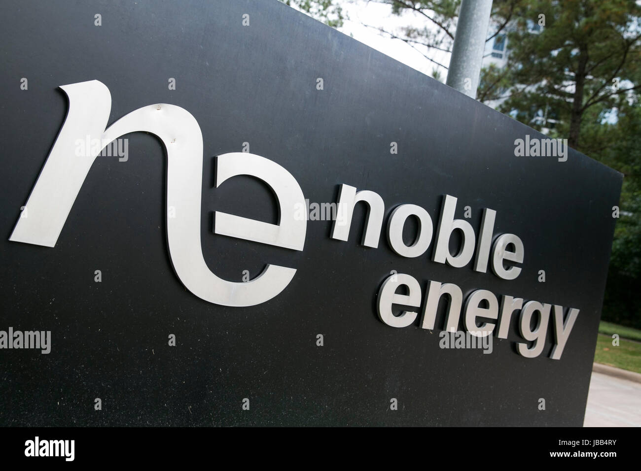 A logo sign outside of the headquarters of Noble Energy, Inc., in ...