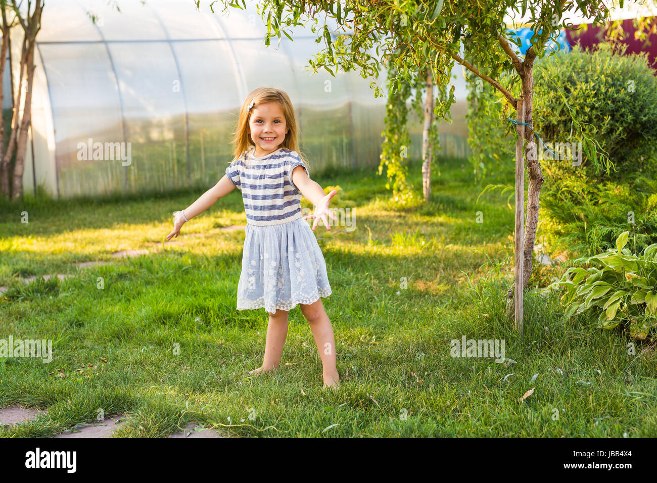 happy child girl playing in summer in nature Stock Photo - Alamy