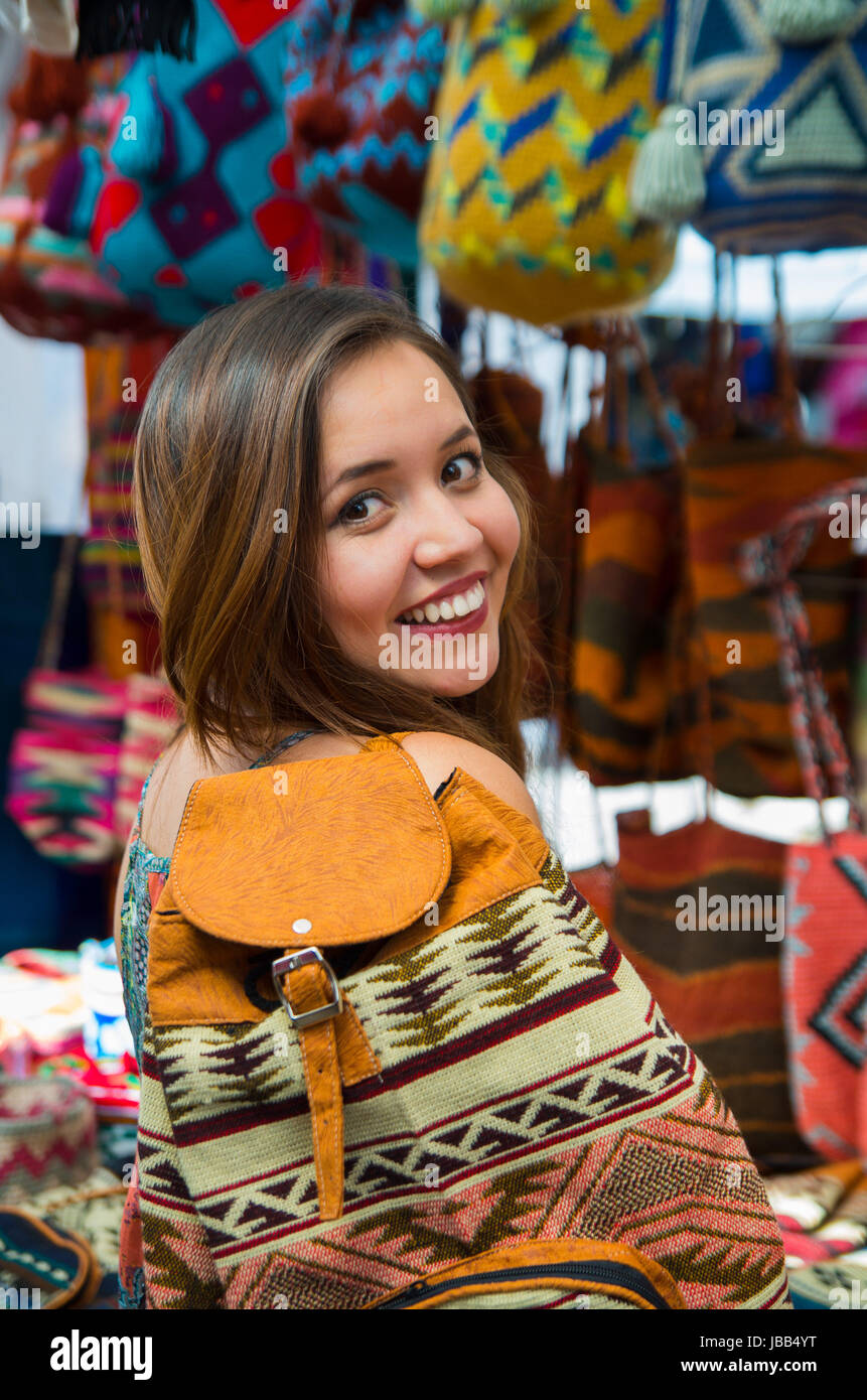 Beautiful woman wearing backpacke, an andean traditional clothing ...