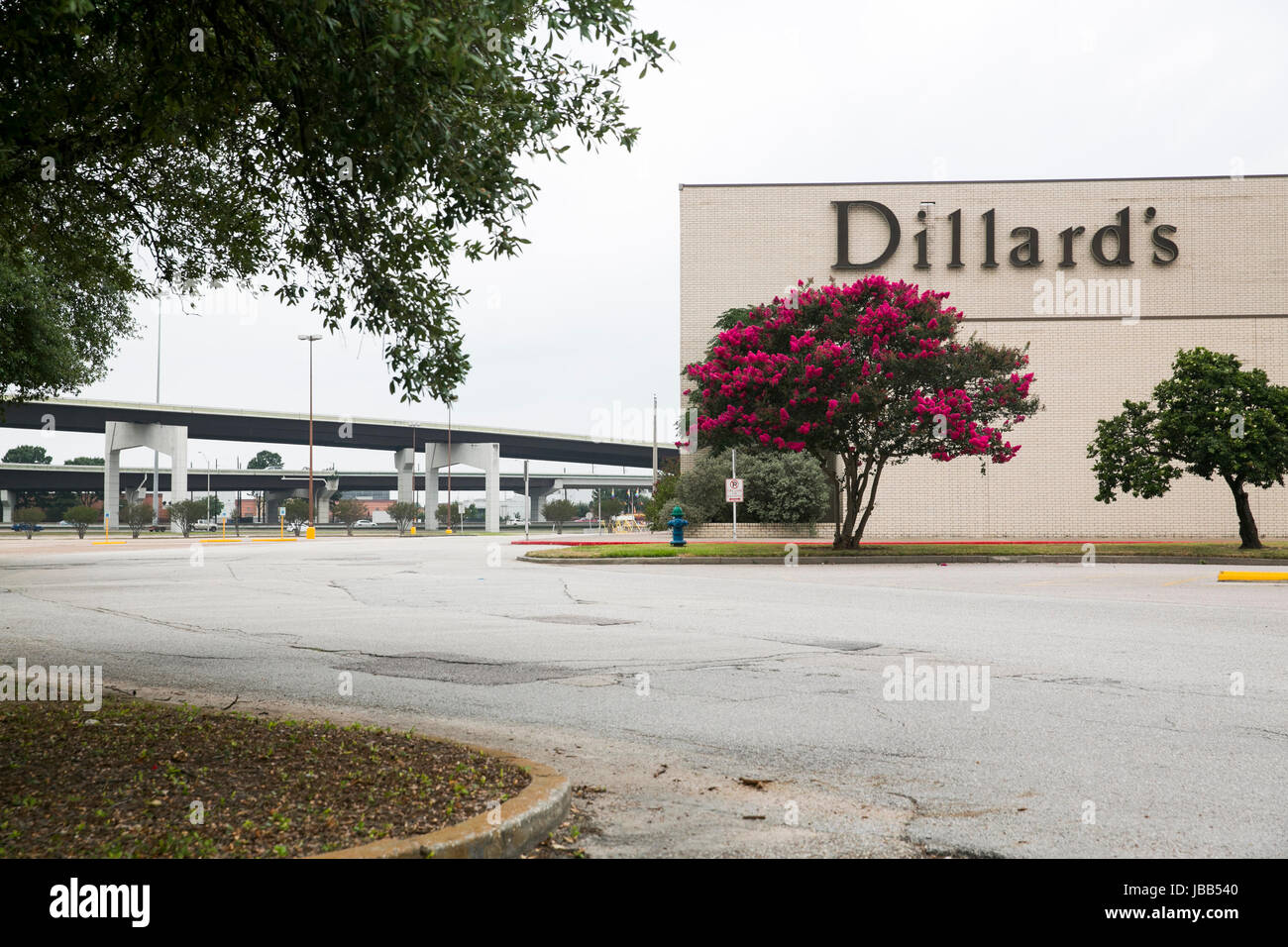 A logo sign outside of a Dillard's, Inc., retail store location in ...