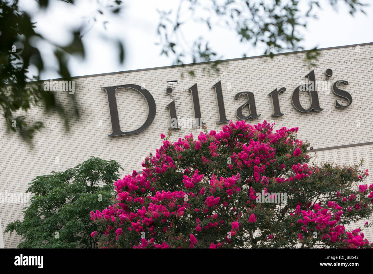 A logo sign outside of a Dillard's, Inc., retail store location in ...