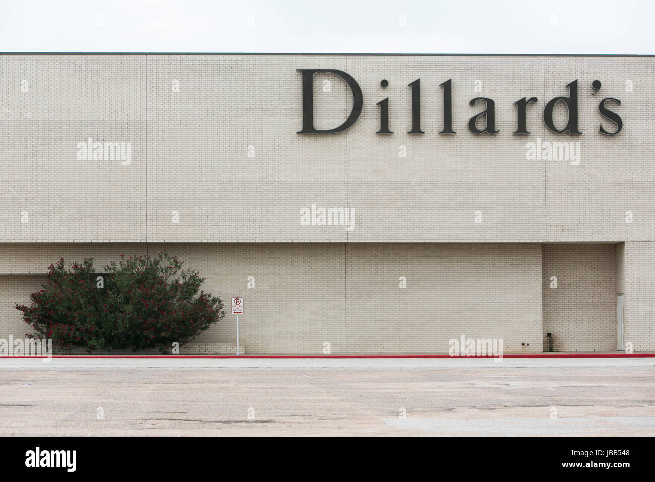 A logo sign outside of a Dillard's, Inc., retail store location in ...