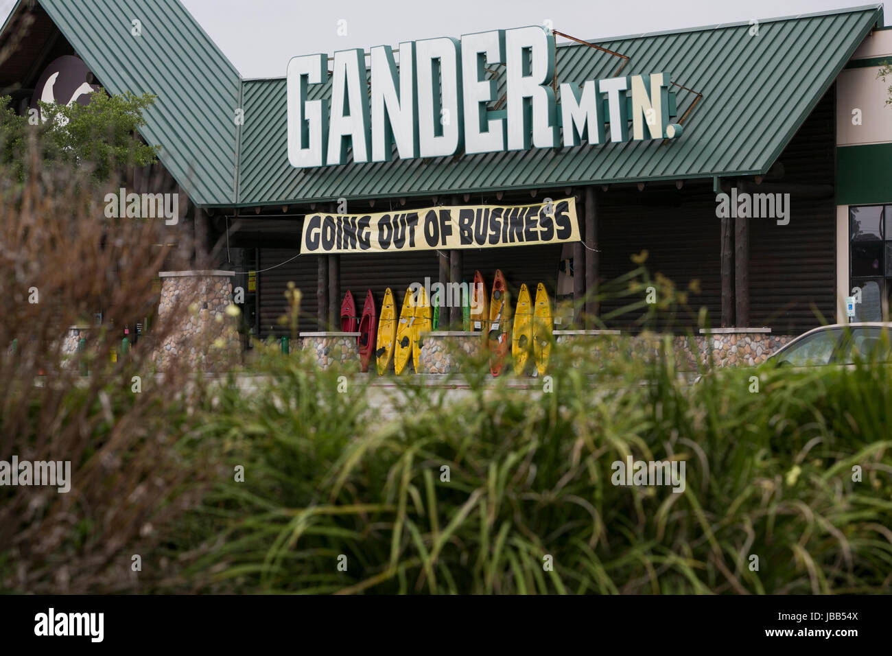 A "Going Out Of Business" banner at a Gander Mountain retail store in ...