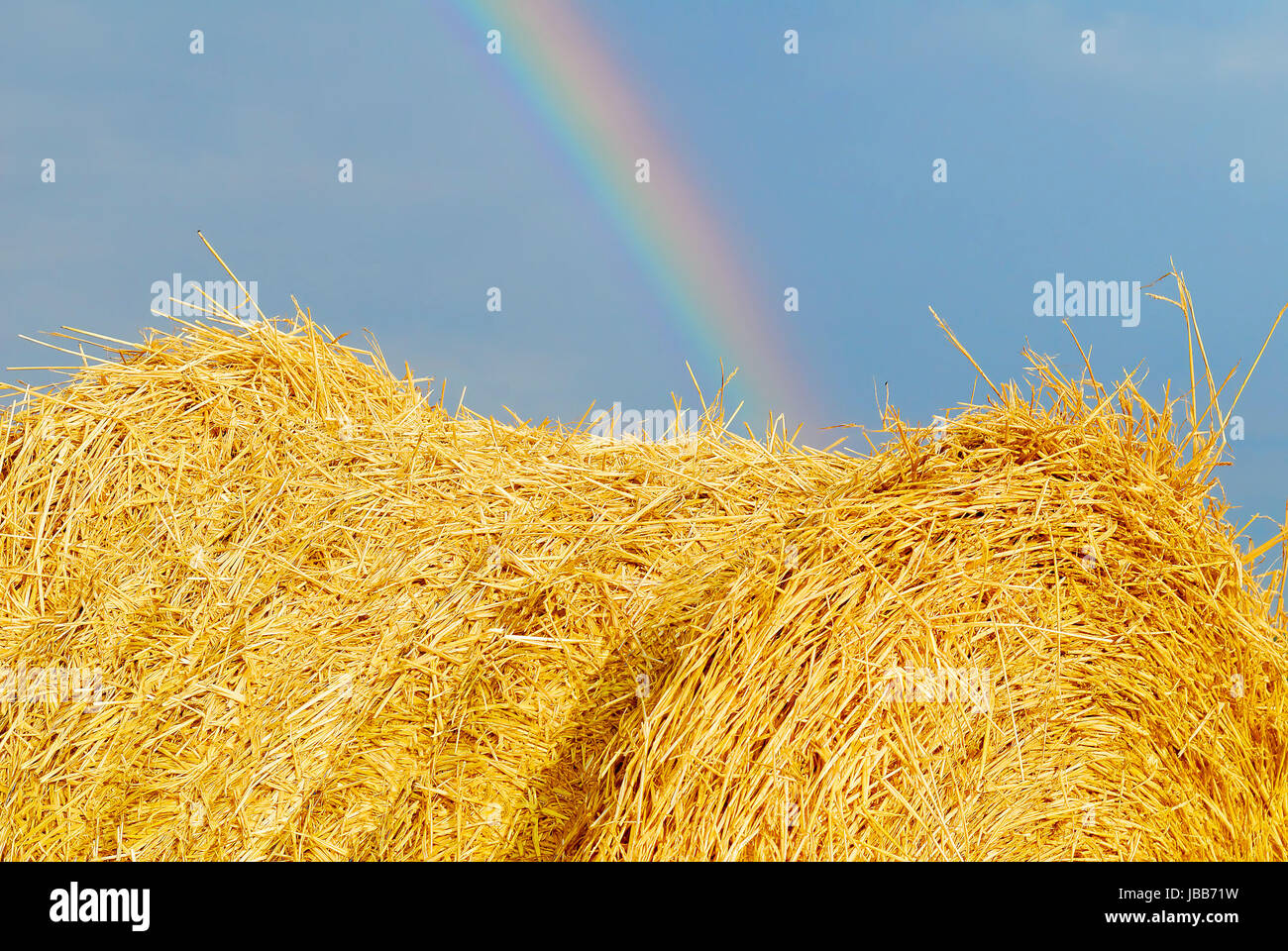 rainbow over a straw ball Stock Photo - Alamy