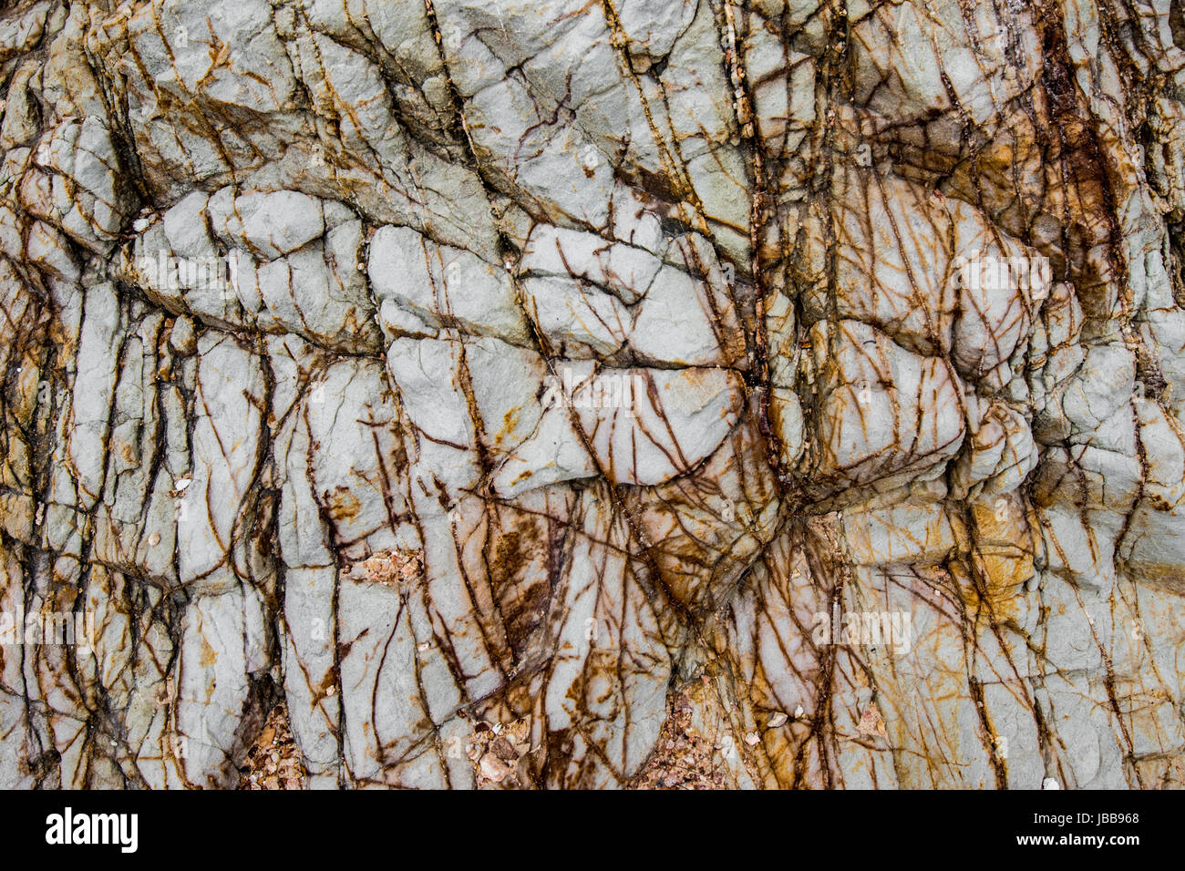 Detailed textures and patterns of a cliff by the beach in Thailand ...