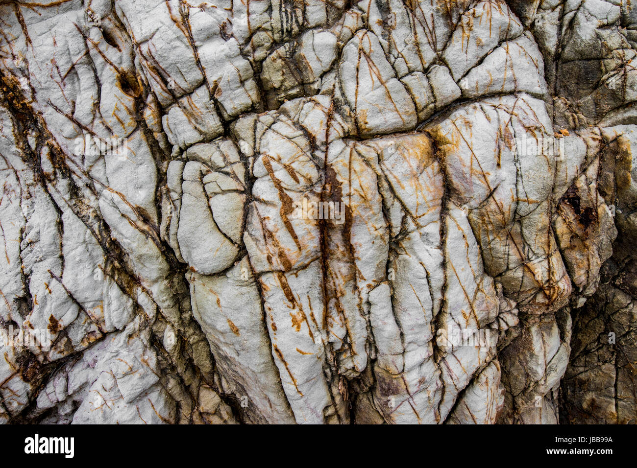 Detailed textures and patterns of a cliff by the beach in Thailand ...