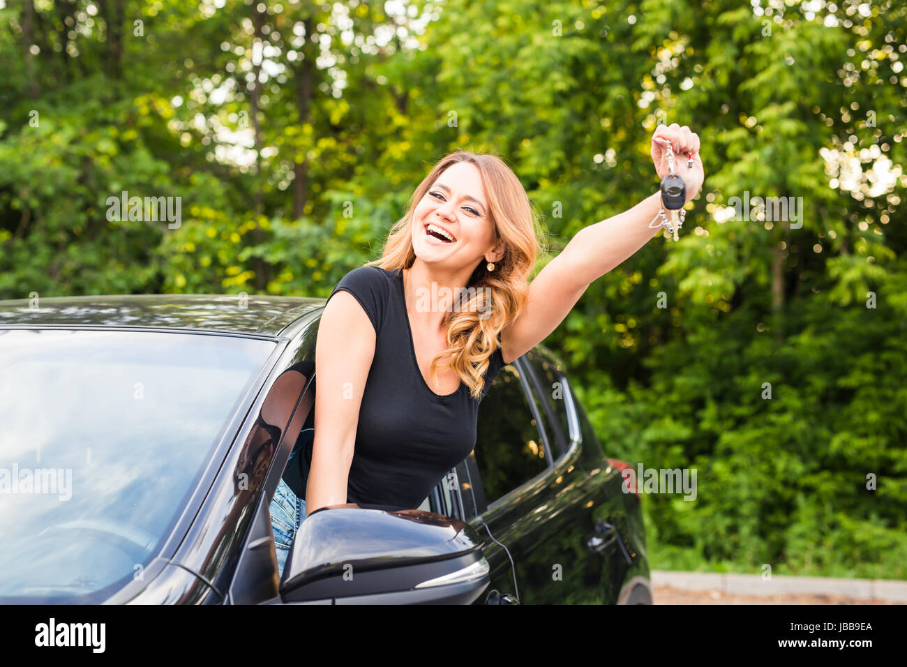 happy woman driver hold car keys in her new car Stock Photo - Alamy