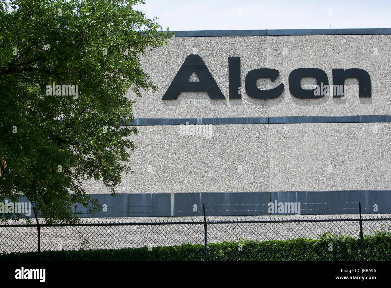 A logo sign outside of a facility occupied by Alcon in Fort Worth ...