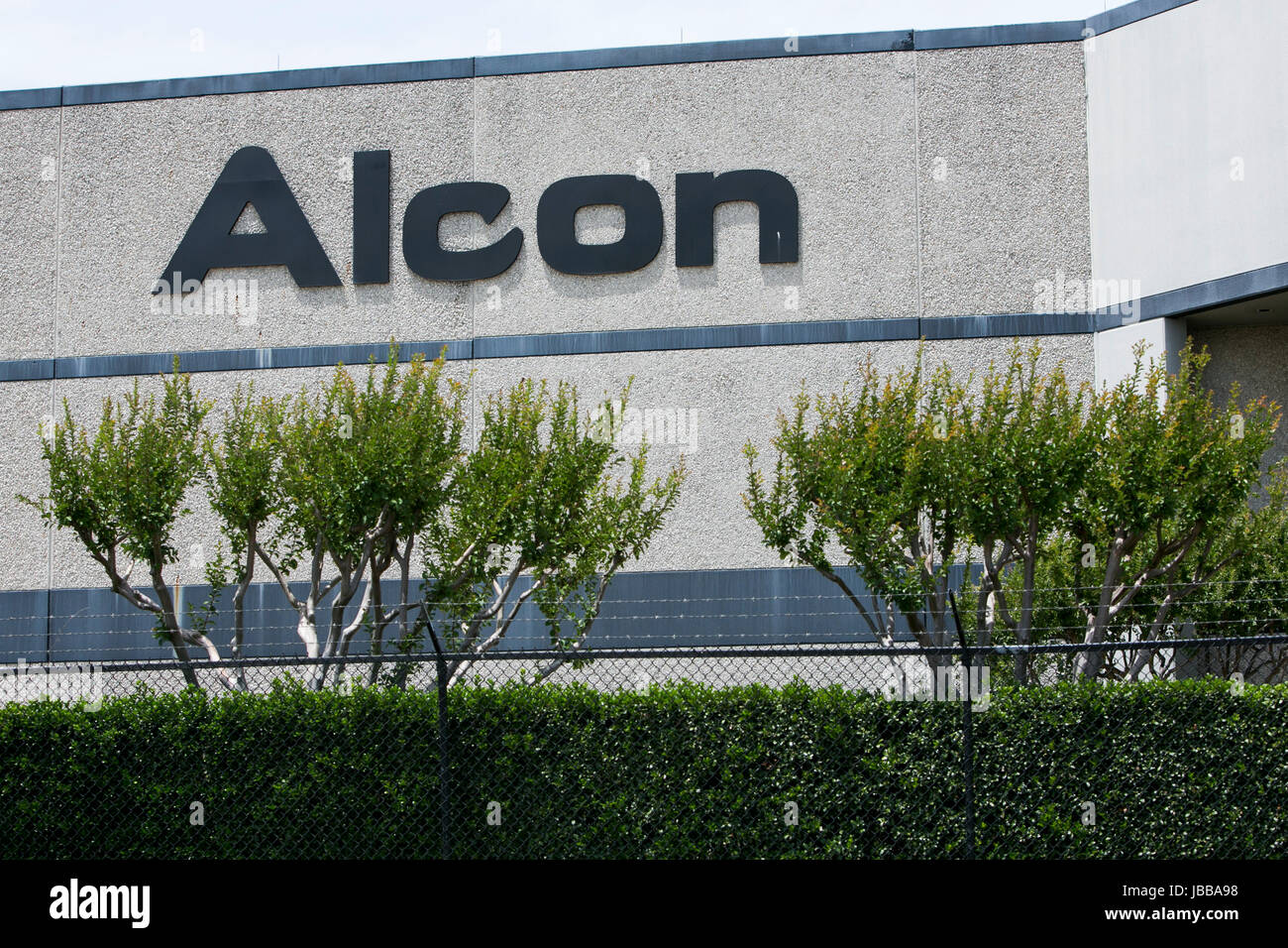 A logo sign outside of a facility occupied by Alcon in Fort Worth ...