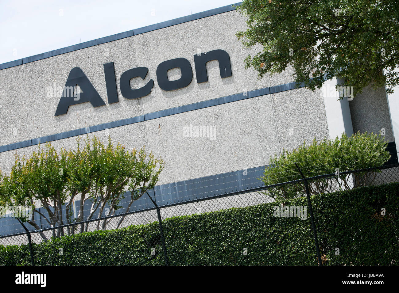 A logo sign outside of a facility occupied by Alcon in Fort Worth ...