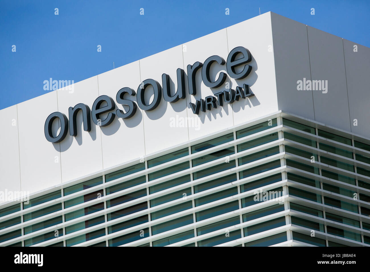 A logo sign outside of a facility occupied by OneSource Virtual in ...