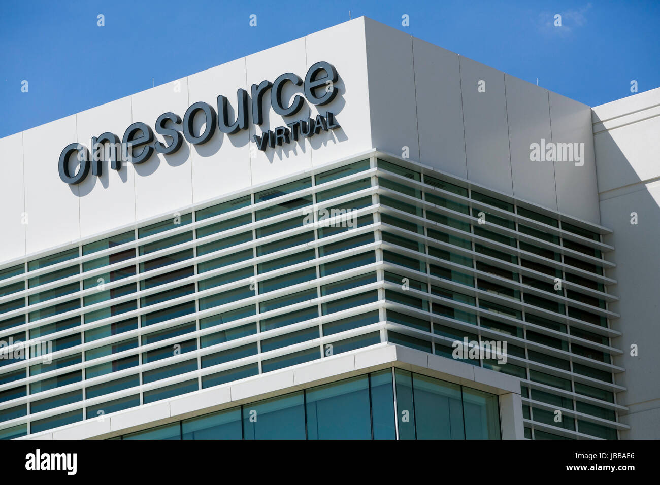 A logo sign outside of a facility occupied by OneSource Virtual in ...