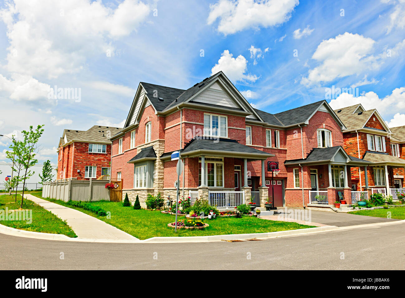 Suburban residential street with red brick houses Stock Photo - Alamy