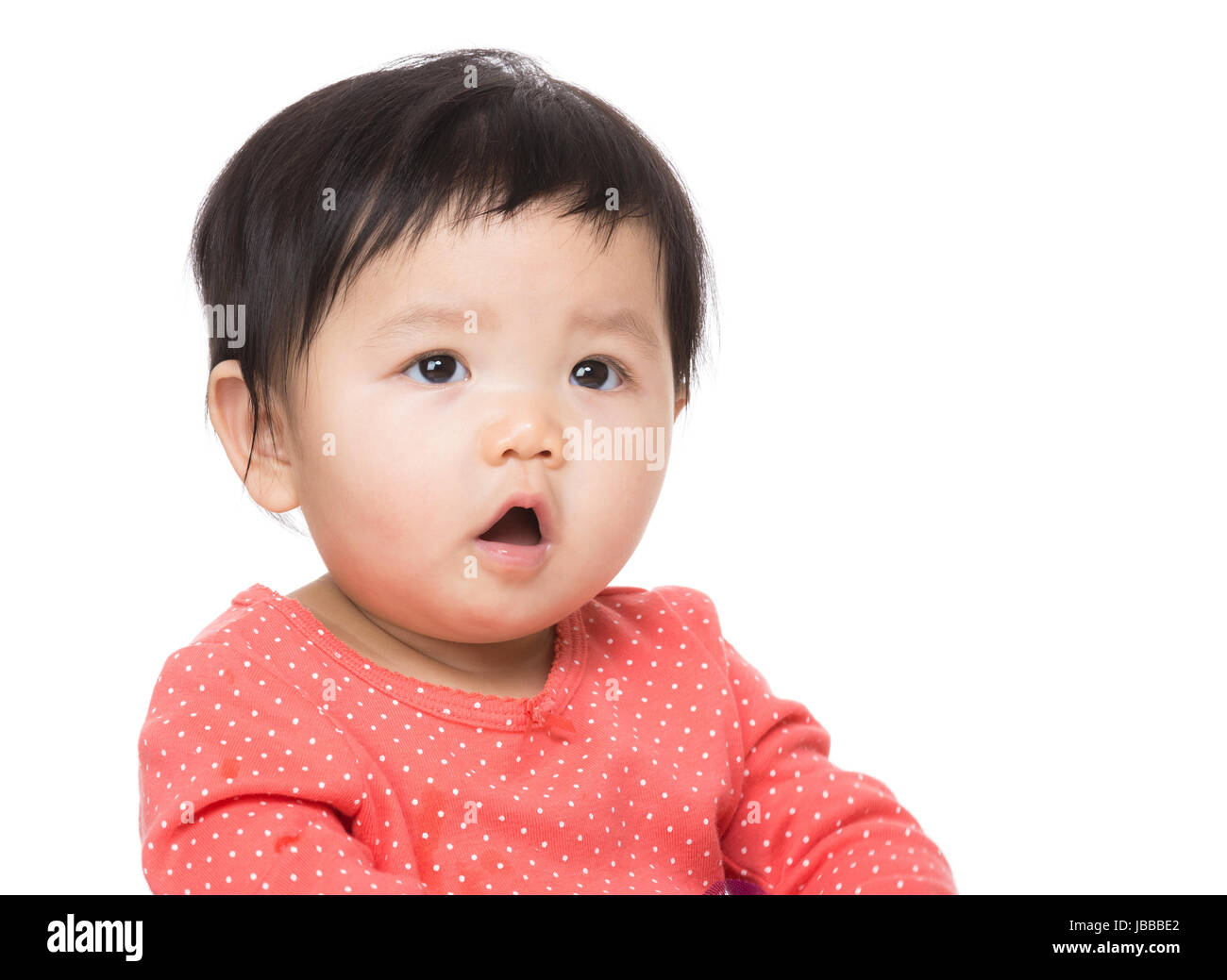 Asian baby girl feeling curiosity Stock Photo - Alamy