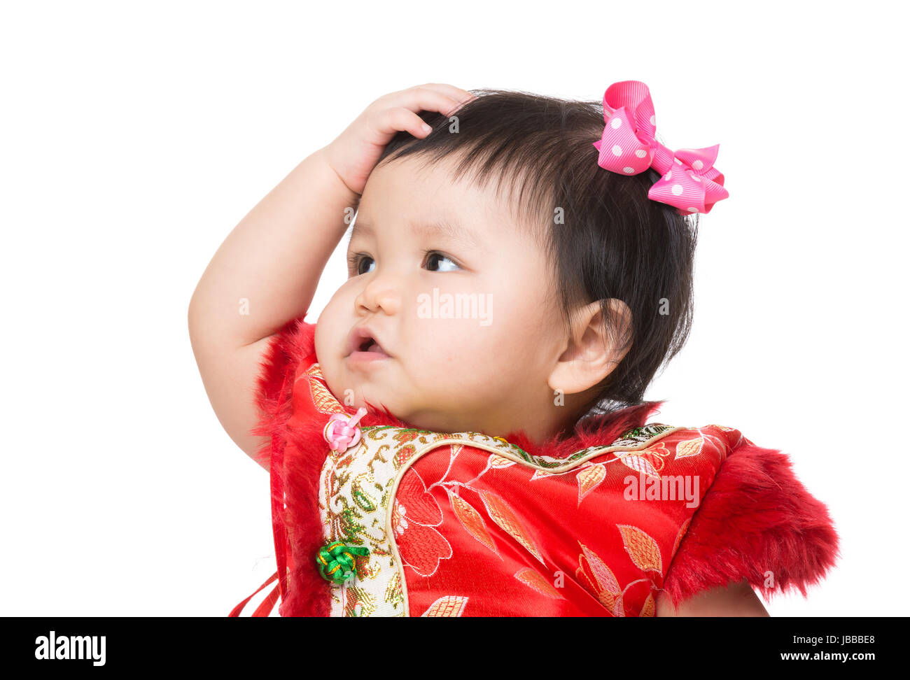 Chinese baby girl scratching head Stock Photo - Alamy