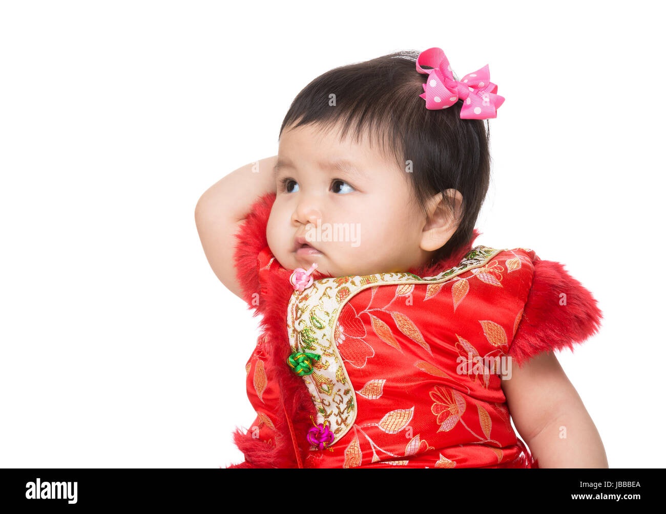 Chinese baby girl touching head Stock Photo - Alamy