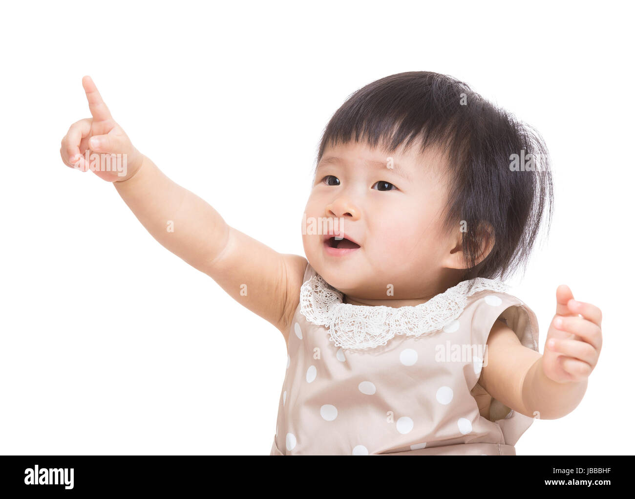 Asian baby girl finger pointing up Stock Photo - Alamy