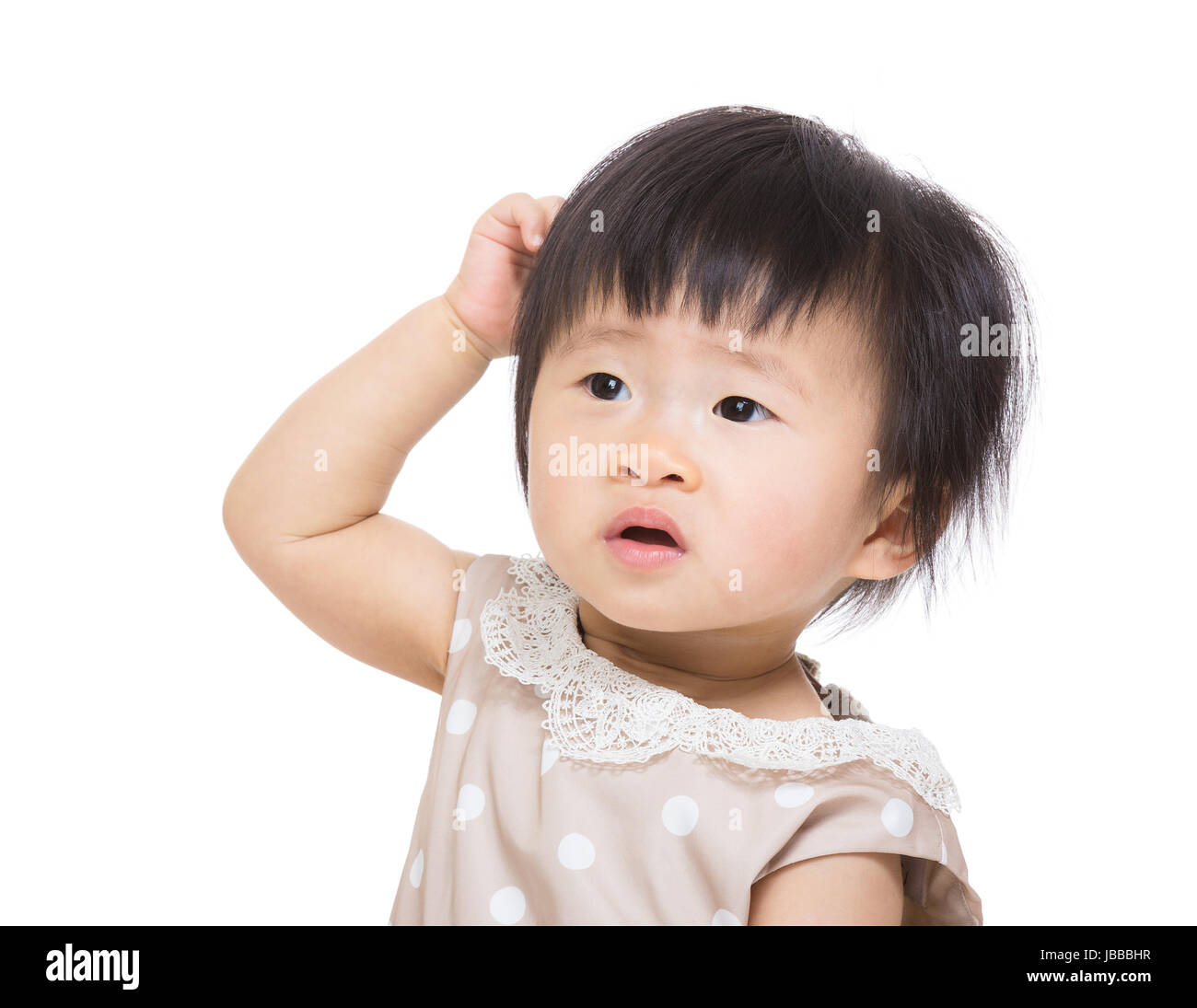 Baby scratch her head Stock Photo - Alamy
