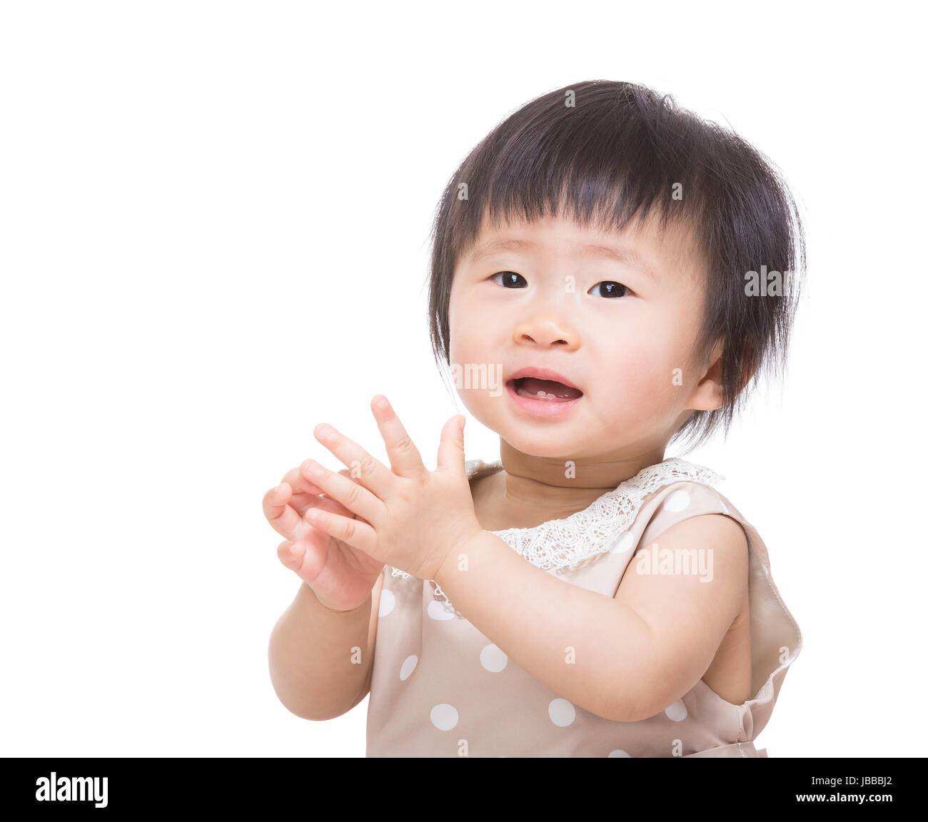 Asian baby girl clapping hand Stock Photo - Alamy