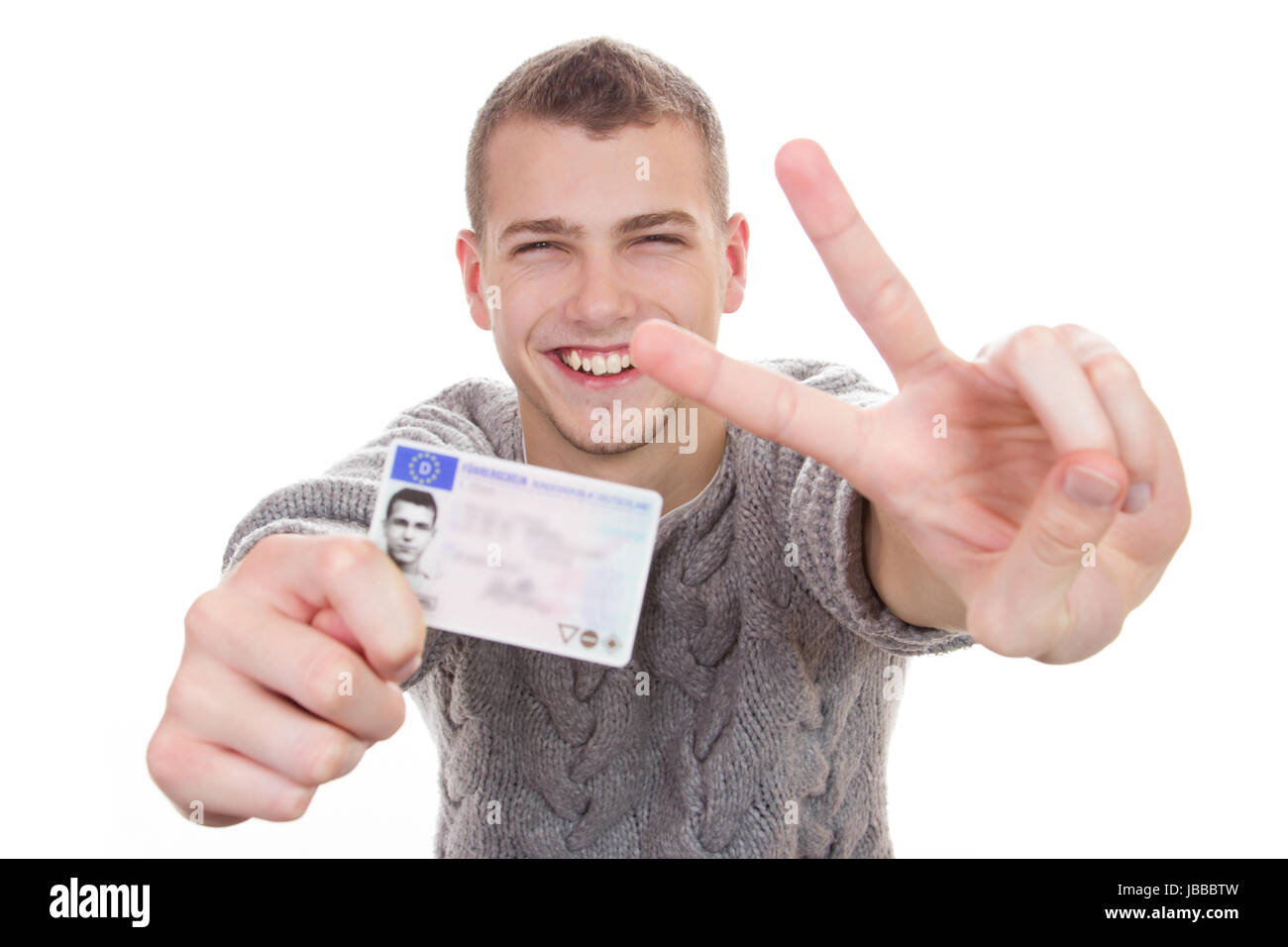 16 to 18 year old boy just received his driver license Stock Photo - Alamy