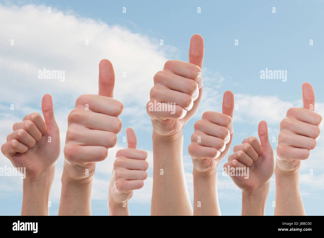 Nice thumbs up collection with blue sky as a background Stock Photo - Alamy